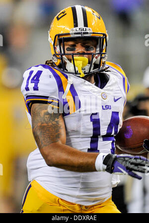 LSU Tigers running back Terrence Magee (18) drops the ball after he is ...