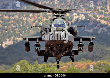 AH-64 Apache attack helicopter in a looping firing off flares Stock ...