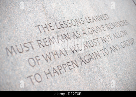 Inscription at the World War II Memorial with the Washington Monument ...