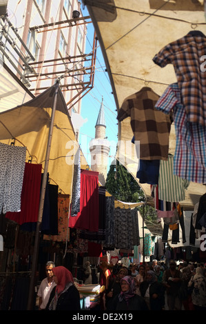 Turkish market stalls selling clothes and people shopping, Türkenmarkt ...