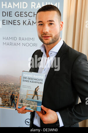 Hamburg, Germany. 11th Sep, 2013. Boxer Hamid Rahimi speaks during the ...