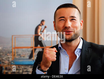 Hamburg, Germany. 11th Sep, 2013. Boxer Hamid Rahimi speaks during the ...