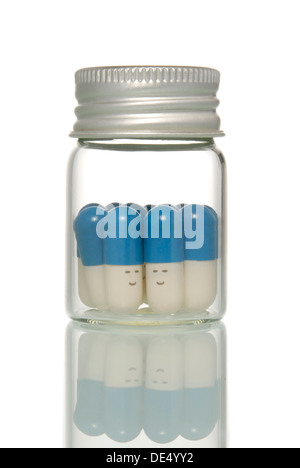 Two pill capsules cut out on white background Stock Photo - Alamy