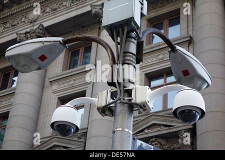 Security cameras mounted on post in public park, selective focus Stock ...