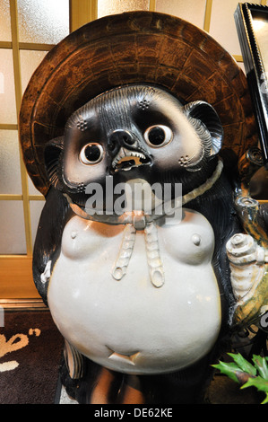 Tanuki (Japanese raccoon dog) statue at Daisho-in temple on Mount Misen ...