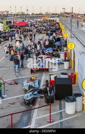 Spectators watch teams prepare race cars at Daytona International ...