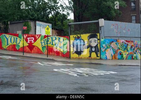 Murals grace the walls of the Welling Court Mural Project in the ...