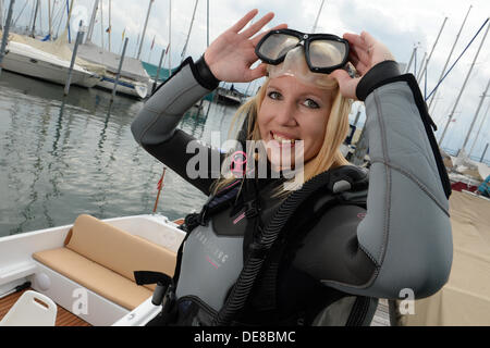 Friedrichshafen, Germany. 13th Sep, 2013. A father and sun paddle on a ...