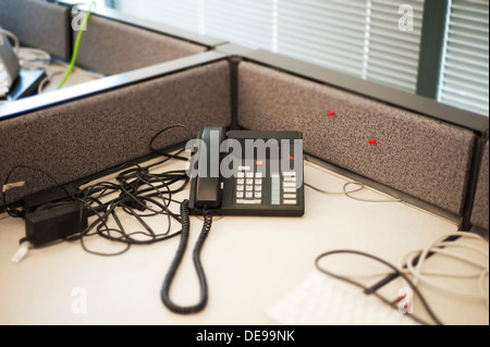 Dusty phone with tangled wires in an abandoned work space Stock Photo ...
