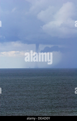 Waterspout forming over an oil rig in the gulf of Mexico, Atlantic ...
