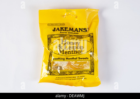 A packet of Jakemans honey and lemon menthol sweets shot on a white ...