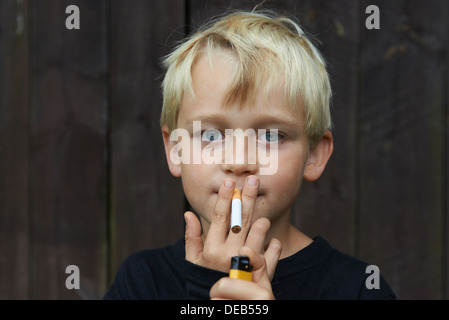 Child blond boy smoking cigarette Stock Photo - Alamy