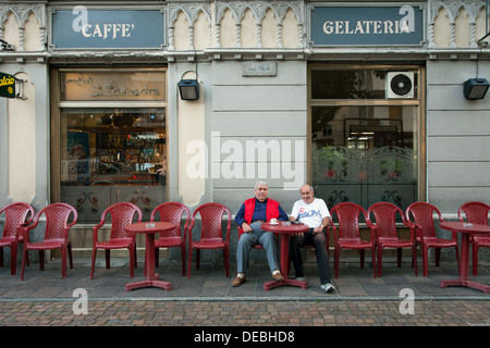 Tirano, Italy, pensioner sitting in a street cafe Stock Photo - Alamy