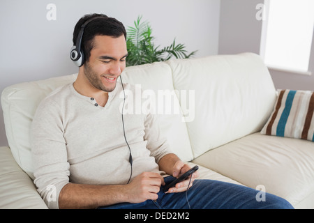 Handsome man listening to the music Stock Photo - Alamy
