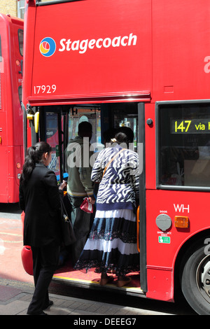 Queue of people boarding a Stagecoach bus in the UK Stock Photo - Alamy