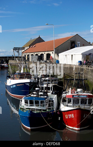 Fishing boats moored in Pittenweem harbour. Fife, Scotland Stock Photo ...