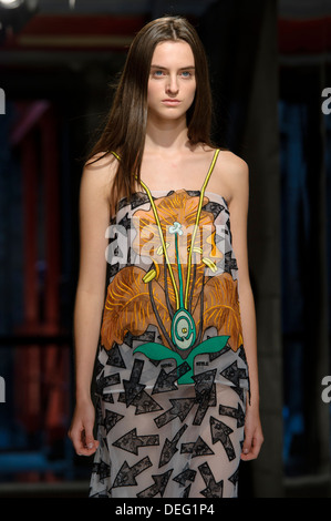 A model wears a design created by Christopher Kane during London ...