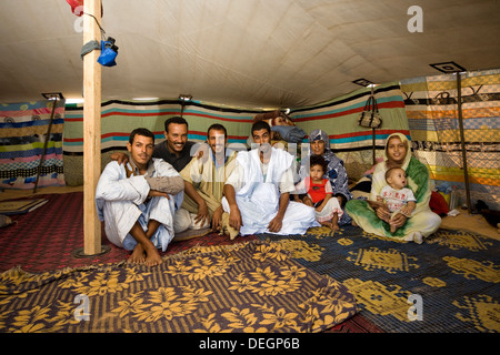 Islamic nomadic family inside their home tent with area community ...