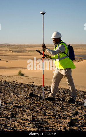 Geological surveyor using differential GPS equipment for a digital ...