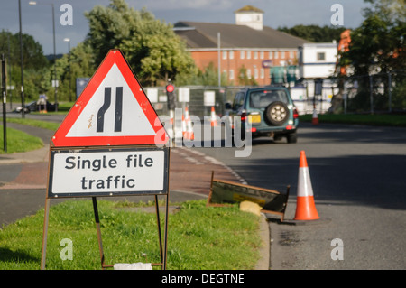 A single file traffic sign warning of a contra flow in roadworks in ...