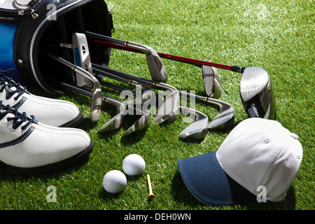 Golf shoes,hat,balls and clubs in bag Stock Photo - Alamy