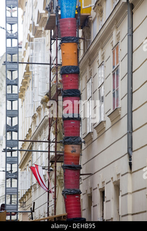 Rubbish Chute On Building Site taking the waste into a skip at the ...