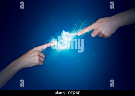 Two hands with pointing fingers and electricity bolts between Stock ...