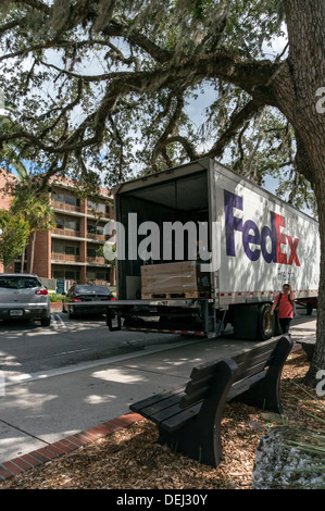 FedEx Freight semi tractor trailer delivery truck with hydraulic tail ...