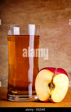 Glass of apple juice and sweet apples on wooden table, organic food and ...
