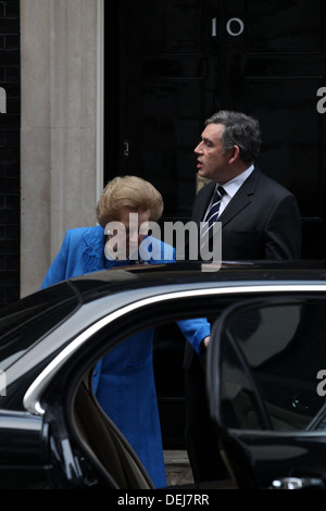 Prime Minister Gordon Brown helps Lady Thatcher down the step of Number ...