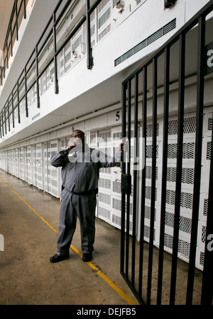 Prison guards inside prison unit near Houston, Texas walk through cells ...