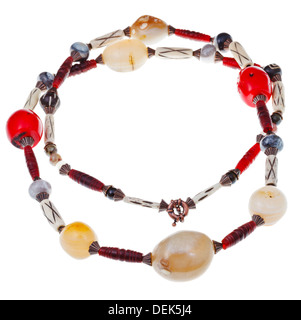 A natural background made of multi-colored wild stone close-up. View ...