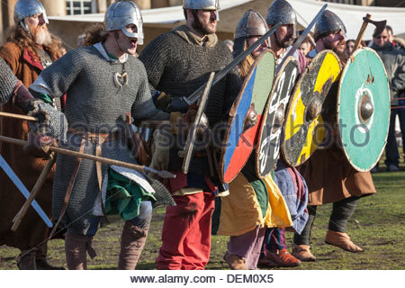 Armed And Armored Men Fight With Swords And Shields At A Festival Of ...