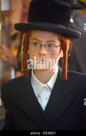 Portrait of an ultra religious Jewish boy with long earlocks on ...