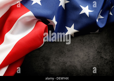 Ruffled USA flag on dark black background with copyspace for text. US ...