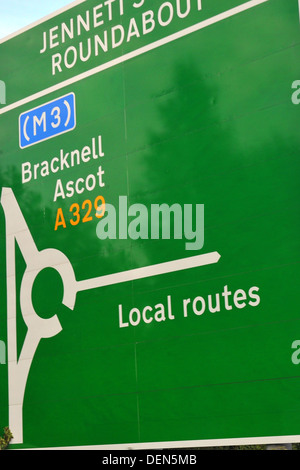 A British roundabout road sign directing traffic to Dorking and South ...