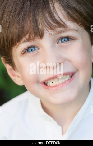 happy boy smiling under blue sky Stock Photo - Alamy