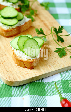 Plate with slices of toasted garlic bread on light background, closeup ...