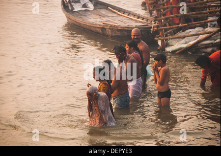 boys bathing in the River Ganges by one of the many Ghats in Varanasi ...
