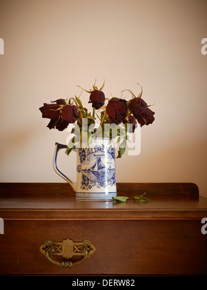 Roses in Heineken beer mug Stock Photo - Alamy