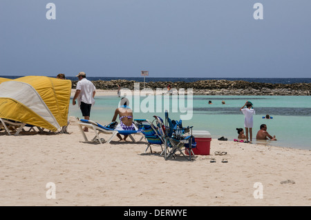 sun tents on Baby Beach in Aruba Stock Photo - Alamy