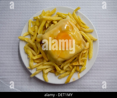 Typical Portuguese francesinha sandwich with french fries isolated on ...
