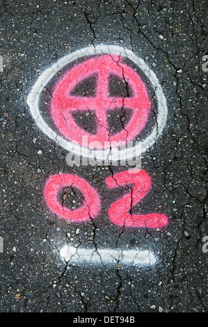 Spray painted markings on street for construction road works cable ...