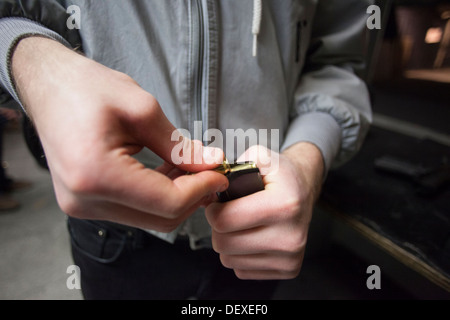 Reloading bullets into a clip at an indoor shooting range on Apr. 5 ...