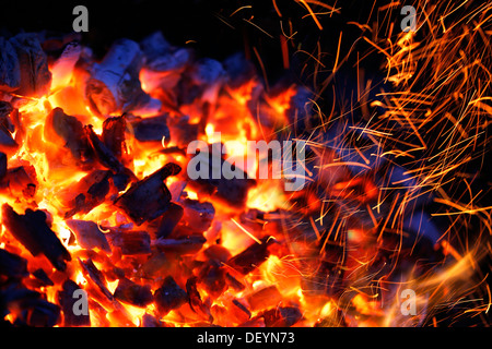 burning charcoal background with fire and sparks Stock Photo - Alamy