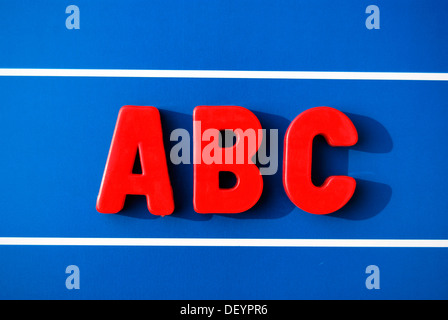 ABC, red magnetic letters, blackboard Stock Photo - Alamy