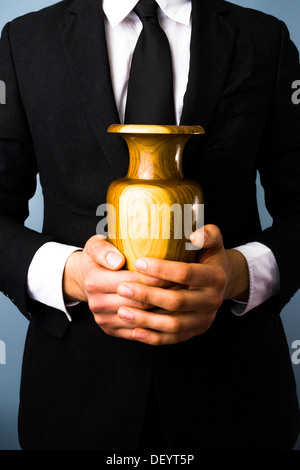 Close-up shot of unrecognizable man holding red box with ring in hands ...