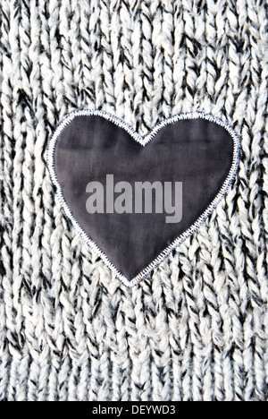 Heart-shaped cloth patch on white background Stock Photo - Alamy