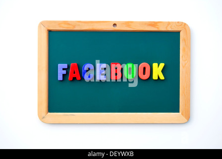 Facebook, written with colourful magnetic letters on a child's ...