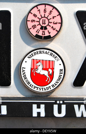 TUEV sticker on a number plate Stock Photo - Alamy